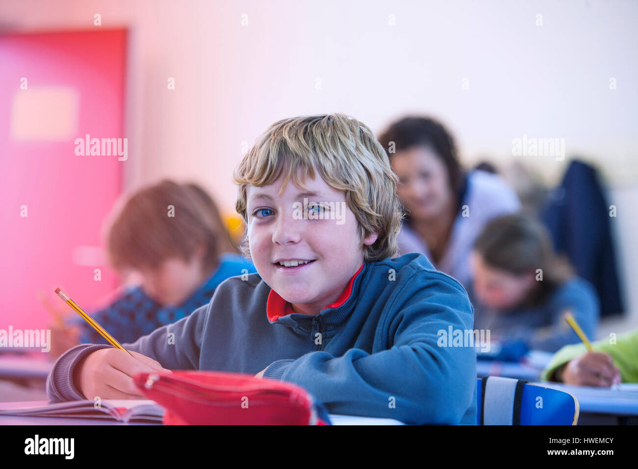 School boy problem solving in classroom hi-res stock photography and ...