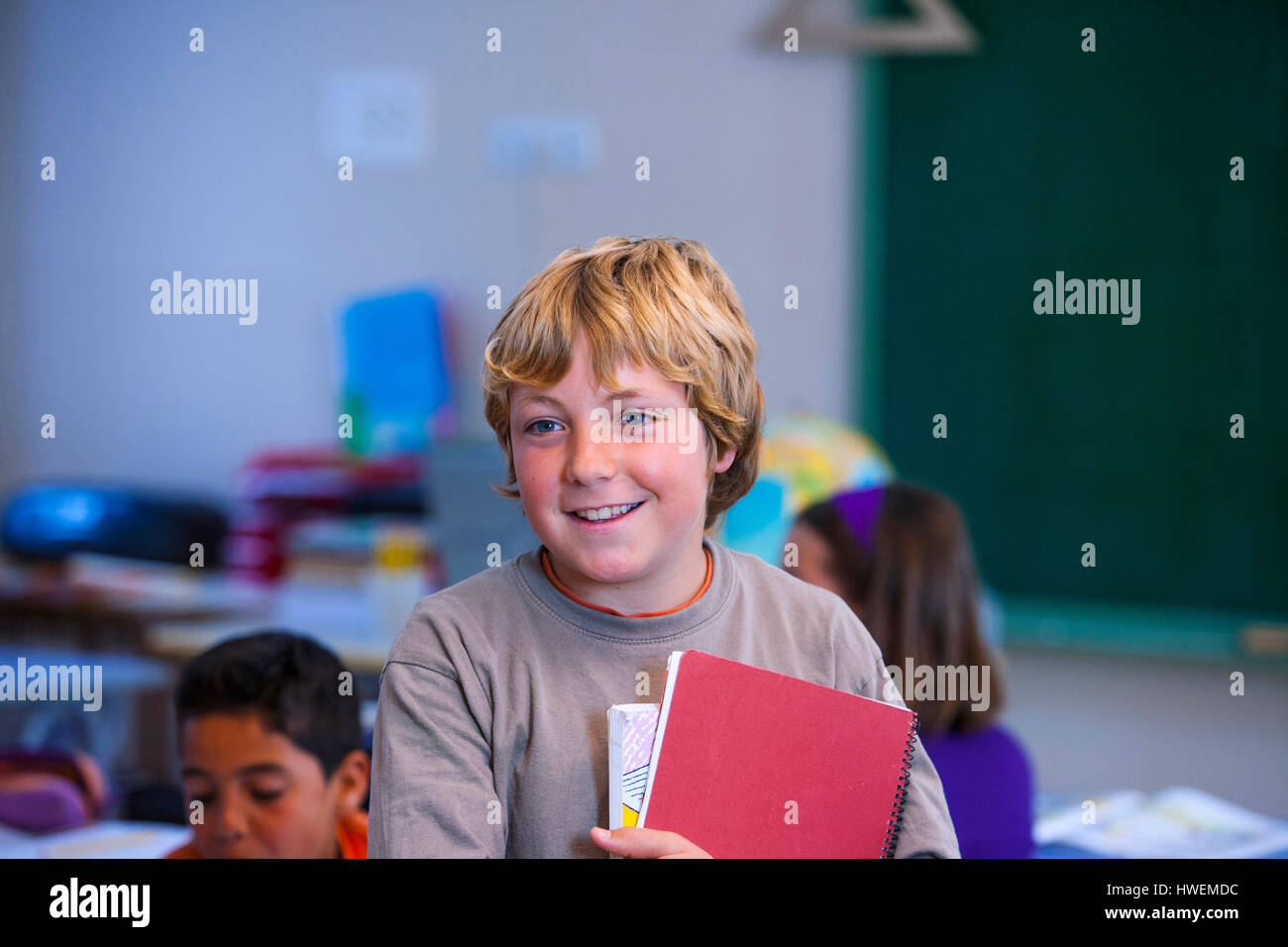 Portrait of boy in classroom Stock Photo - Alamy