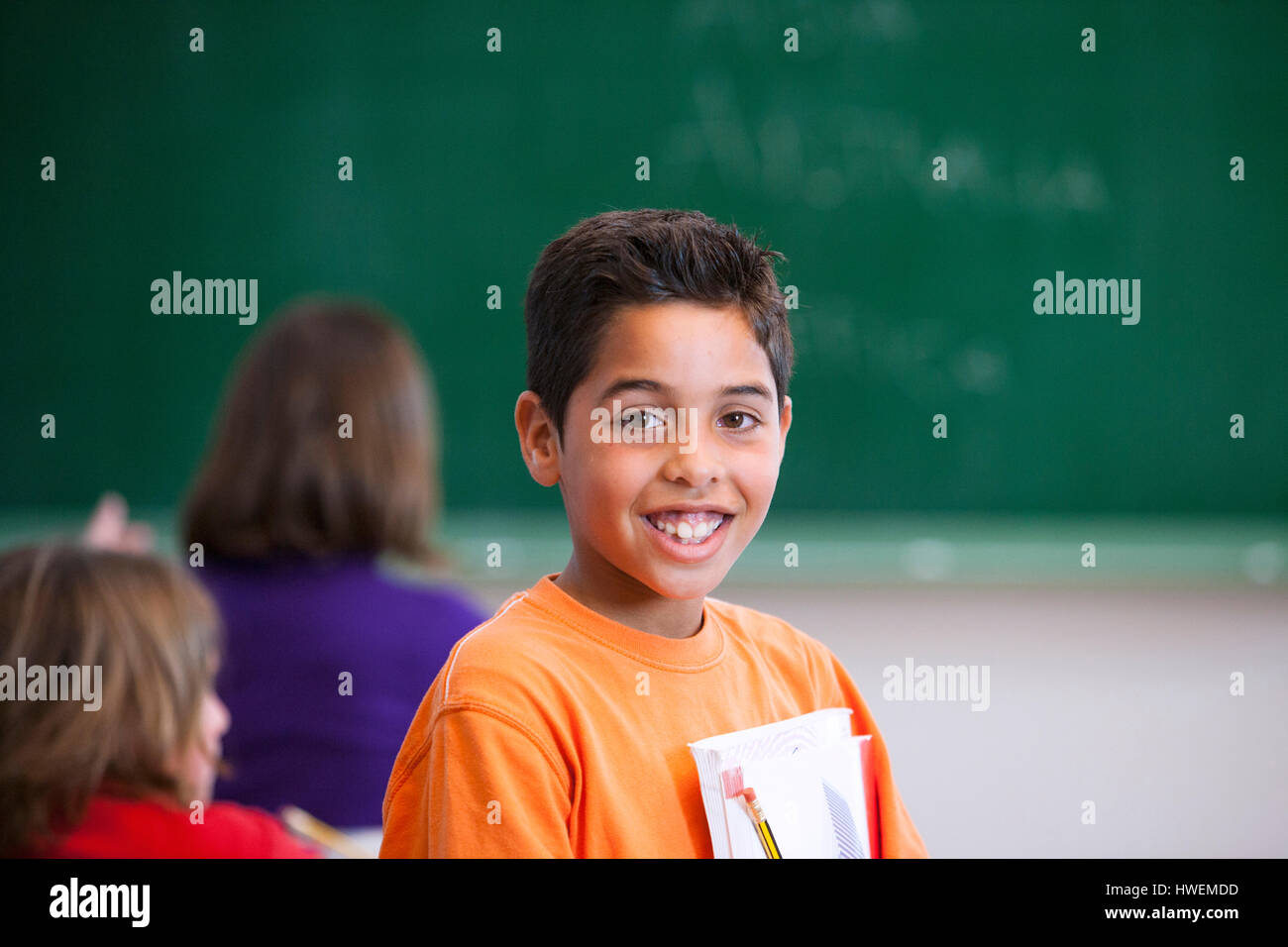 Portrait of boy in classroom Stock Photo - Alamy