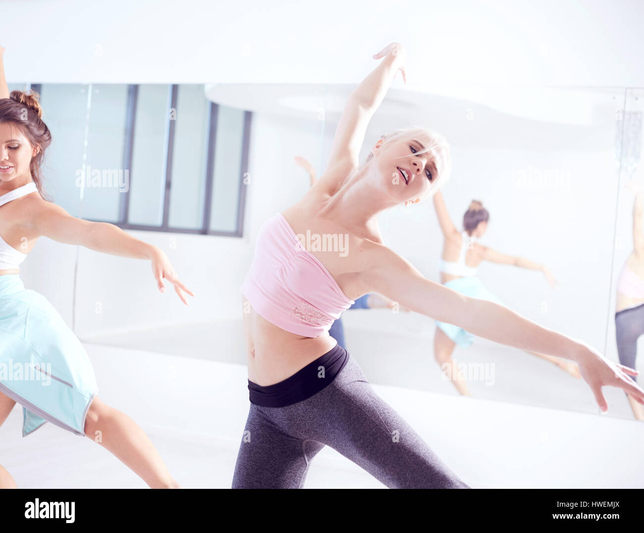 Female ballet dancers practicing, dancing with arms open Stock Photo ...
