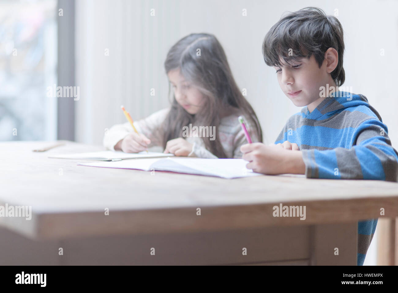 Brother and sister writing hi-res stock photography and images - Alamy