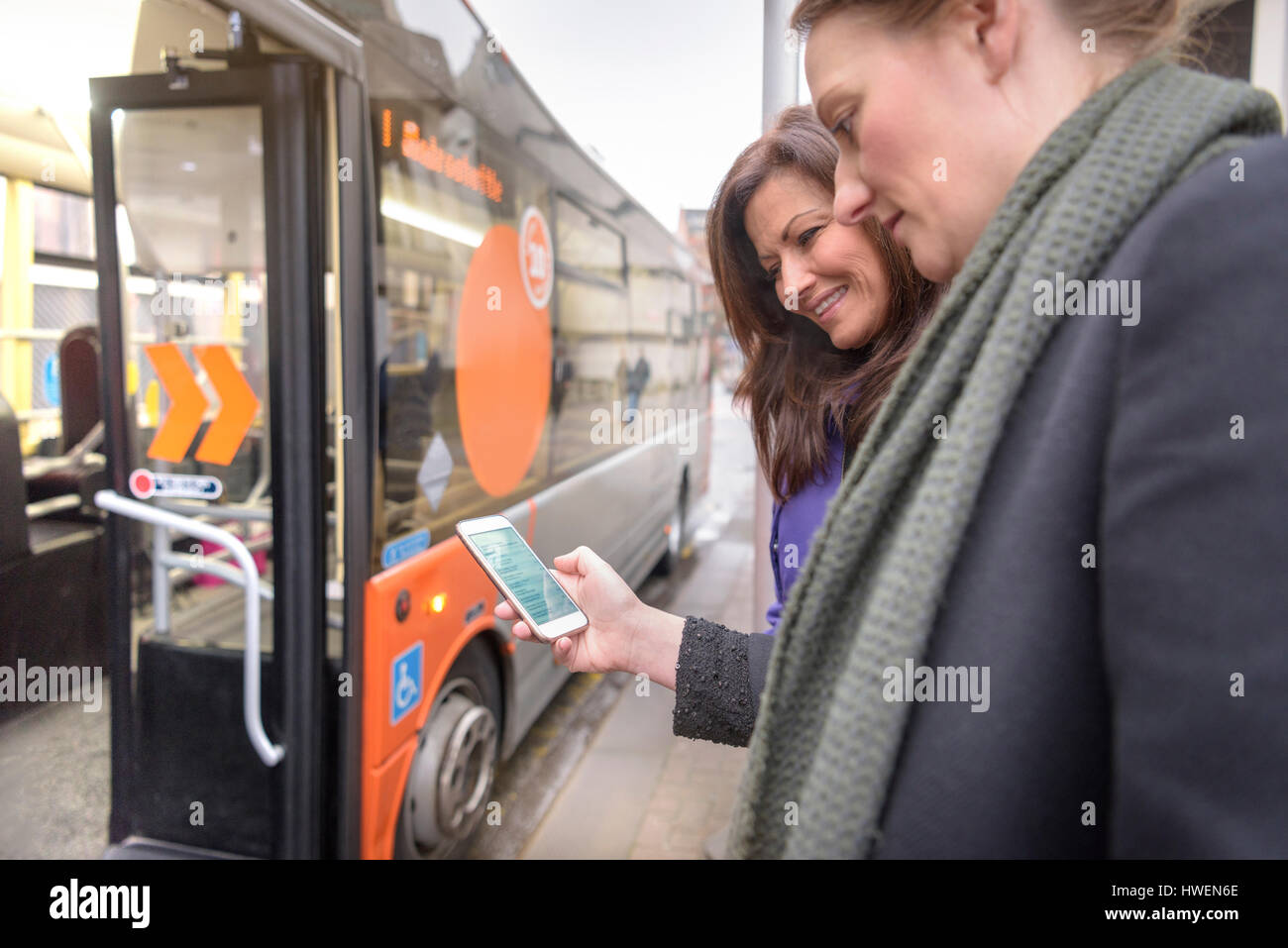 Bus passengers standing hi-res stock photography and images - Alamy