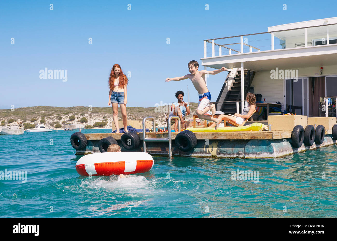 Family having fun on houseboat sun deck, Kraalbaai, South Africa Stock ...