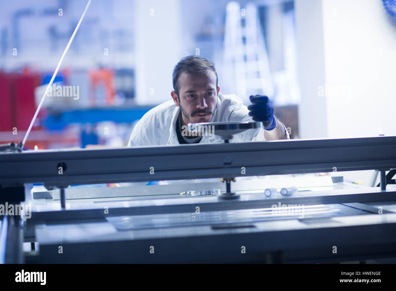 Scientist operating heavy machinery Stock Photo - Alamy