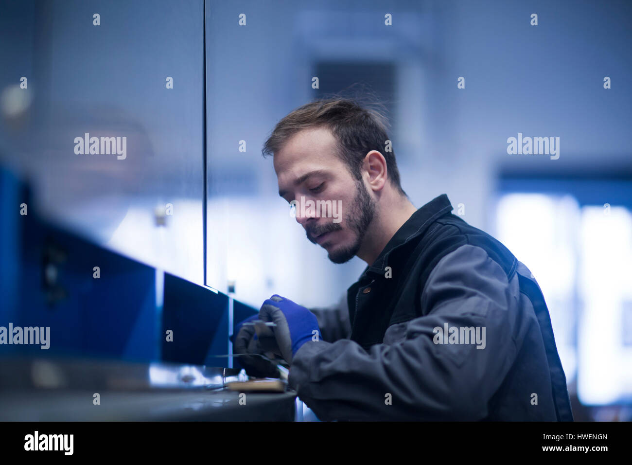 Engineer inspecting heavy machinery Stock Photo - Alamy