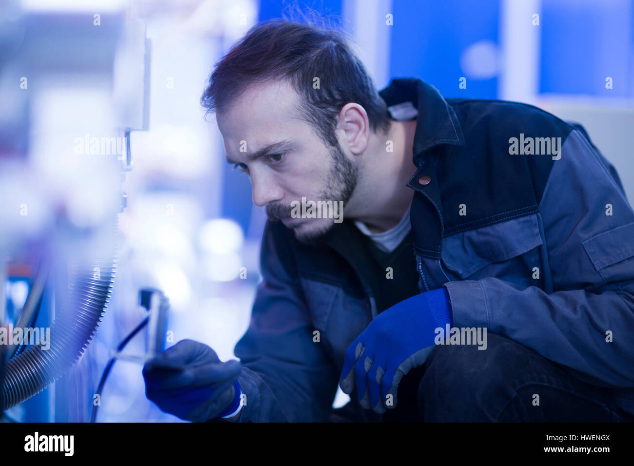 Inspecting machinery hi-res stock photography and images - Alamy