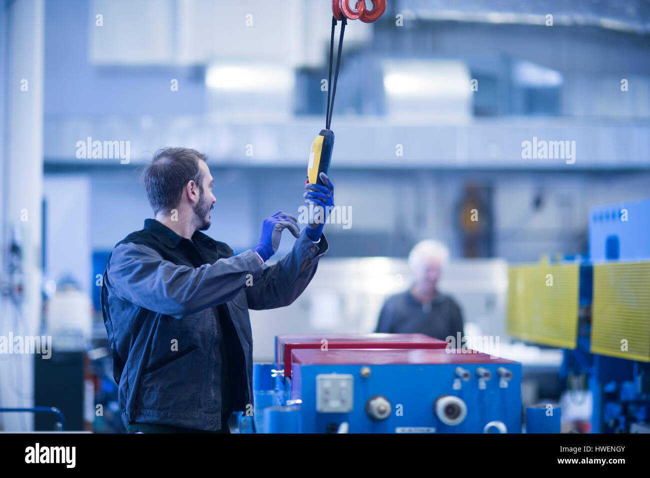 Engineer operating heavy machinery Stock Photo - Alamy