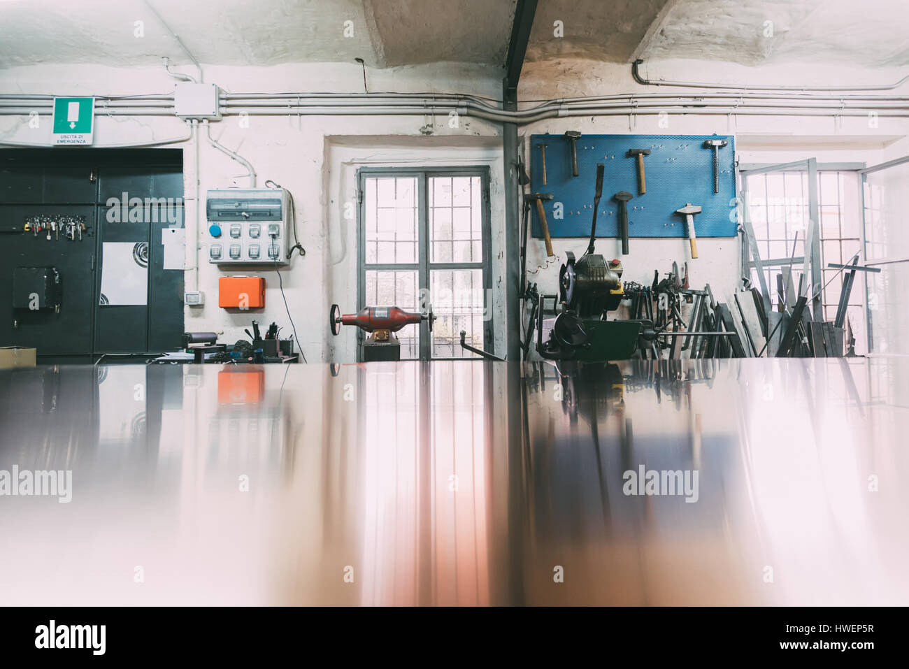 Sheet copper on workbench in forge workshop Stock Photo - Alamy