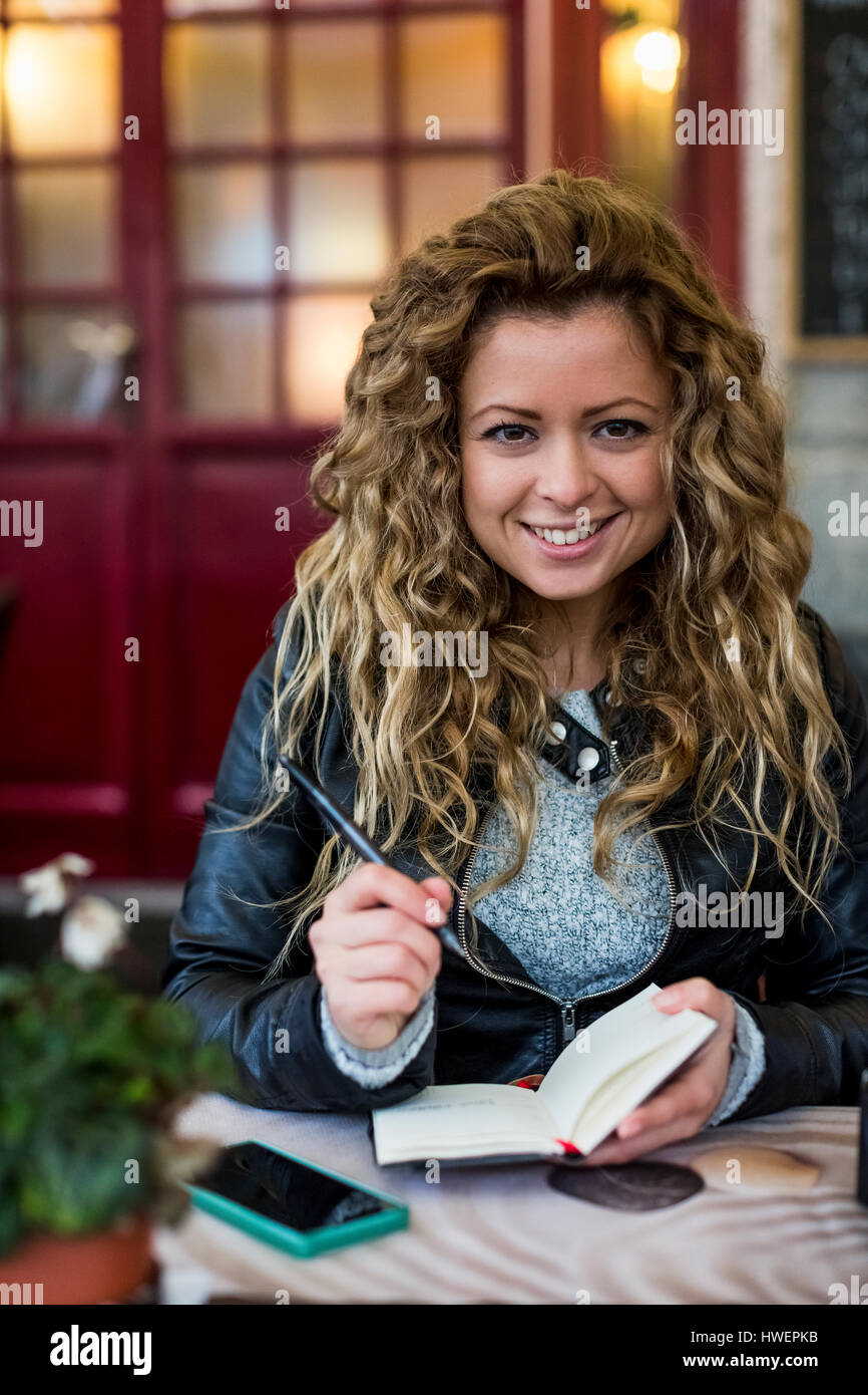 Woman writing notebook hi-res stock photography and images - Alamy