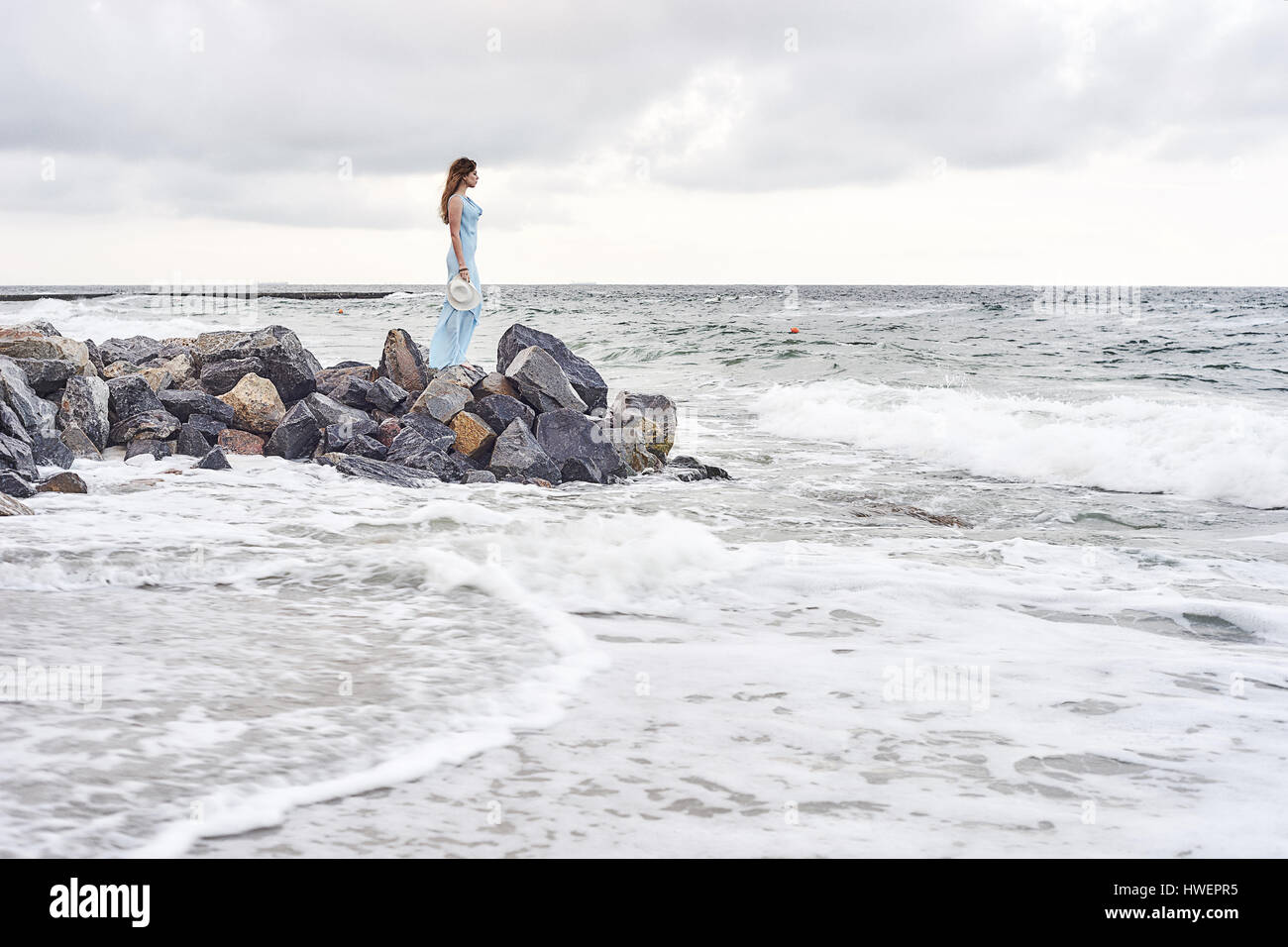 Woman standing coast looking sea hi-res stock photography and images ...
