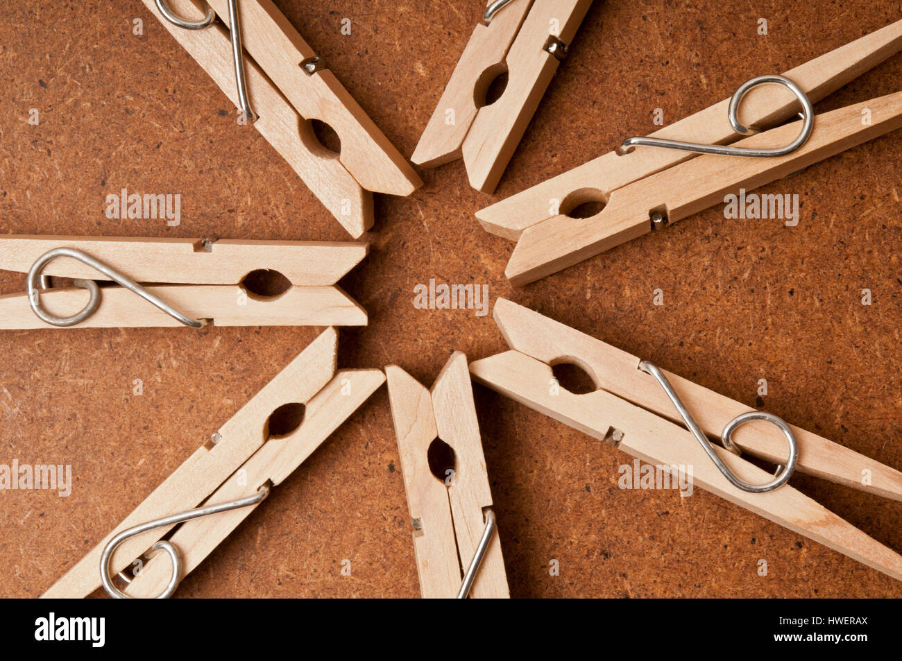 wooden clothes pegs in a circle Stock Photo - Alamy