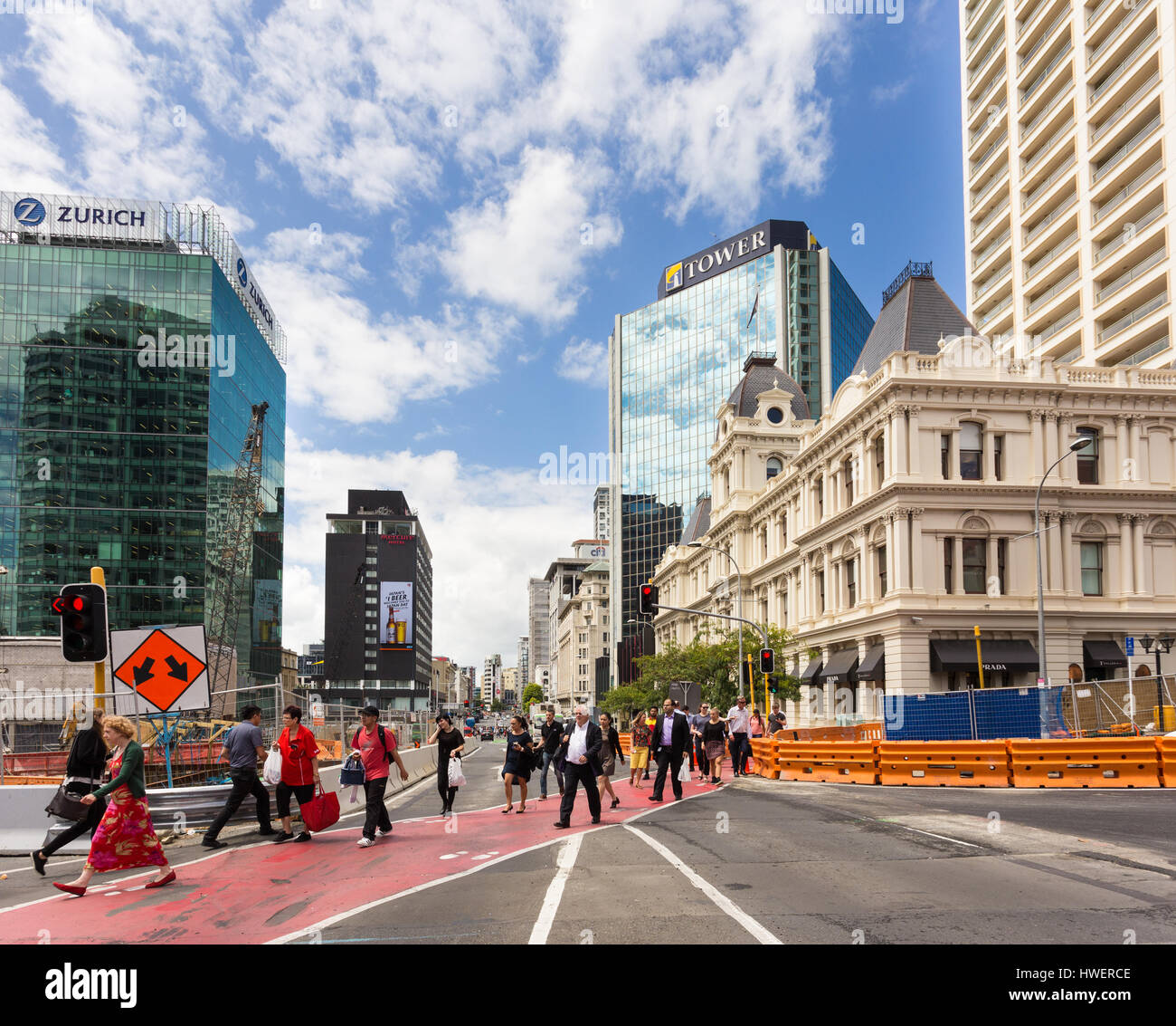 AUCKLAND, NEW ZEALAND - FEBRUARY 22, 2017: Pedestrains cross a street ...