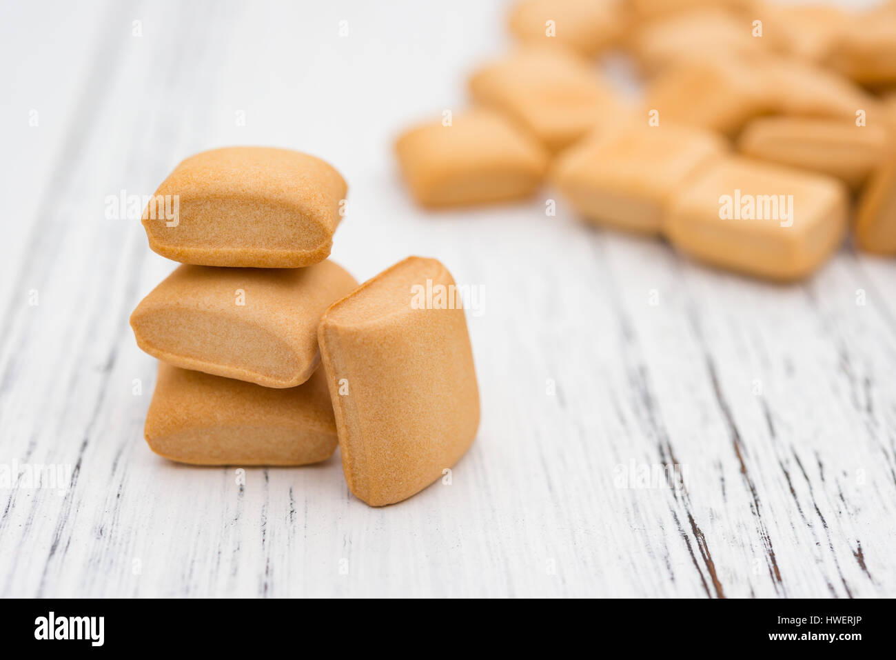 square shape biscuit stacks up on white wood Stock Photo - Alamy
