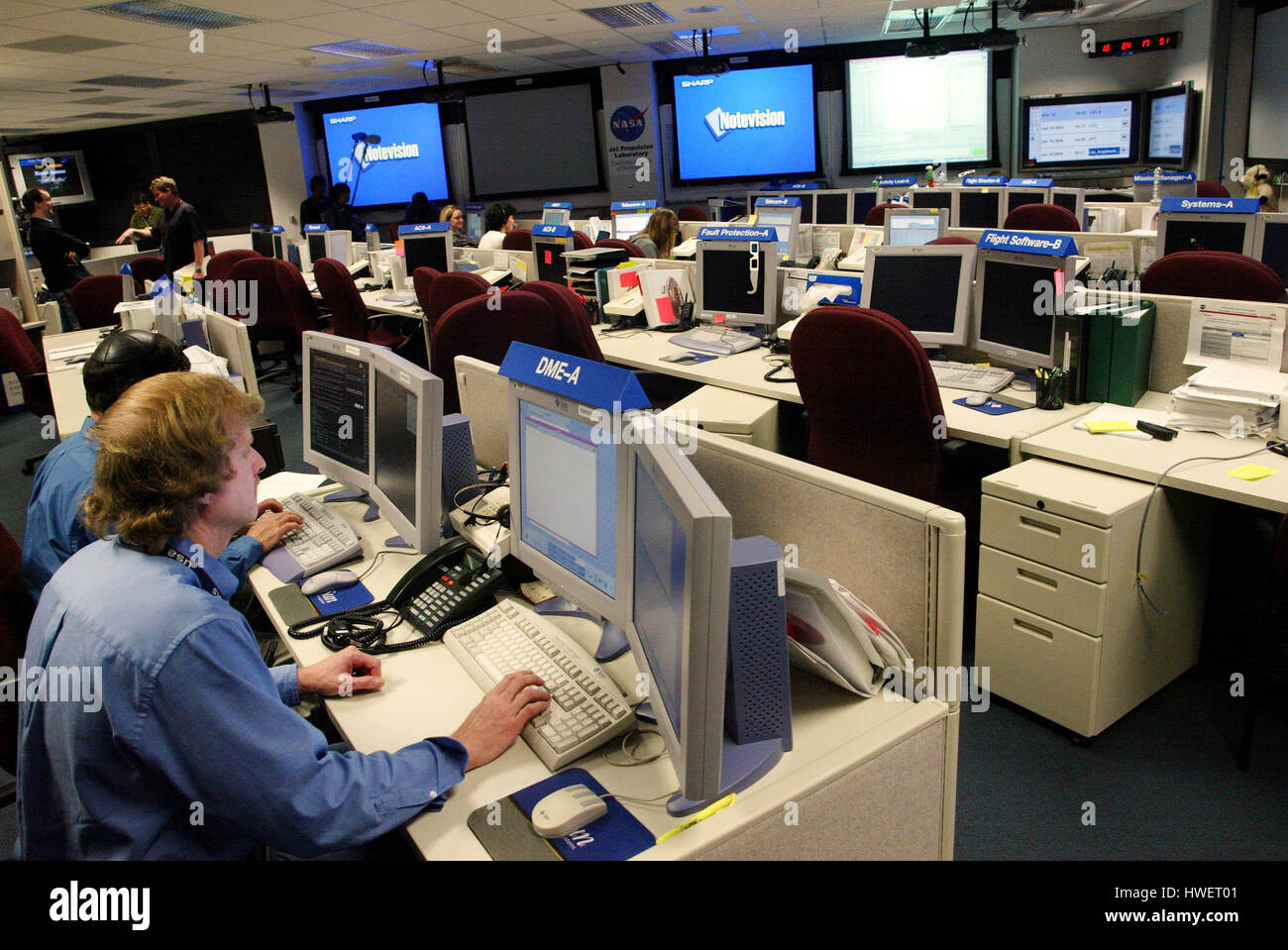 Kirk Fleming, (L) of NASA's Jet Propulsion Laboratory man the control ...