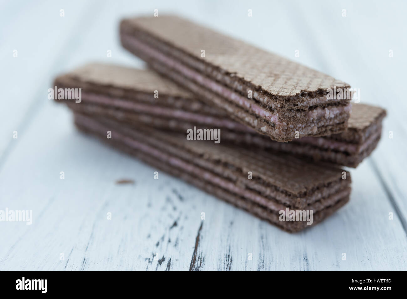 strawberry flavor wafer blocks on white wood background Stock Photo - Alamy