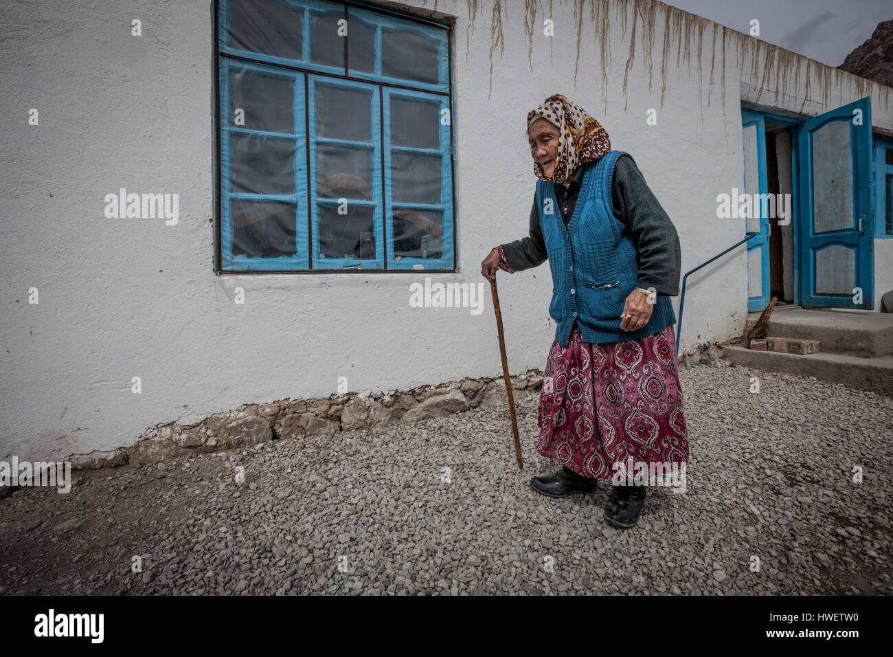 Old woman walking stick hi-res stock photography and images - Alamy