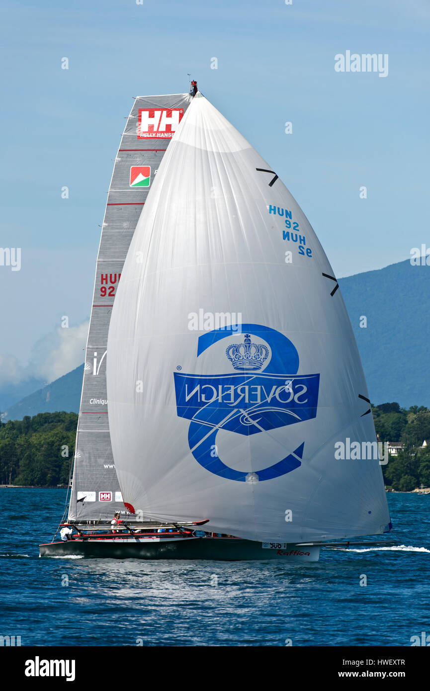 Sailing boat flying a spinnaker sail on Lake Geneva, boat HUN 92 ...