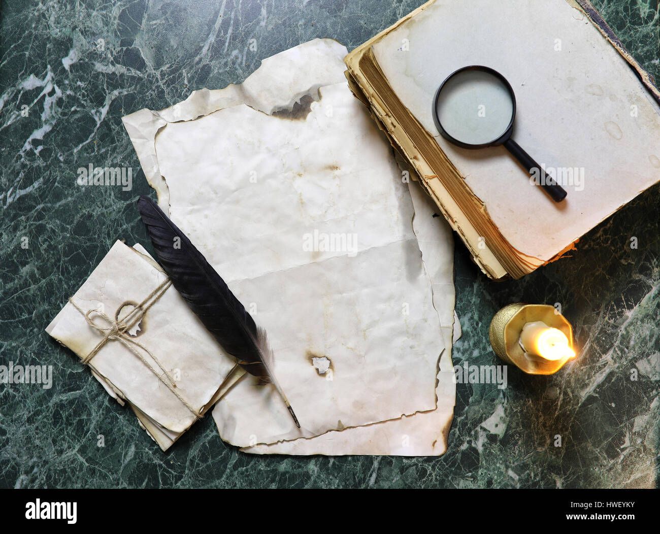 retro papers and book on detective work table with tools Stock Photo ...