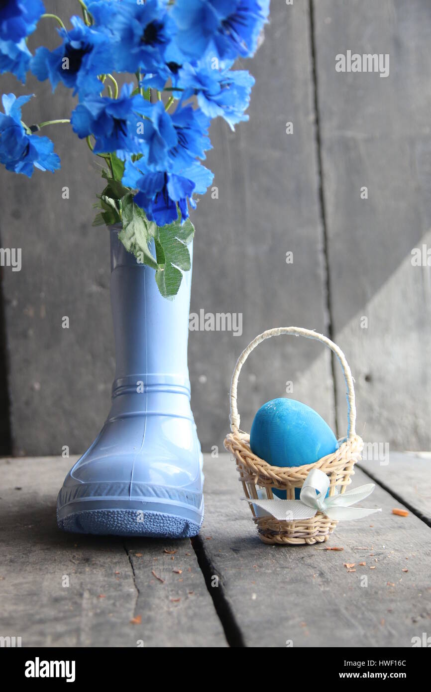 Easter spring background Blue egg And flowers Stock Photo - Alamy
