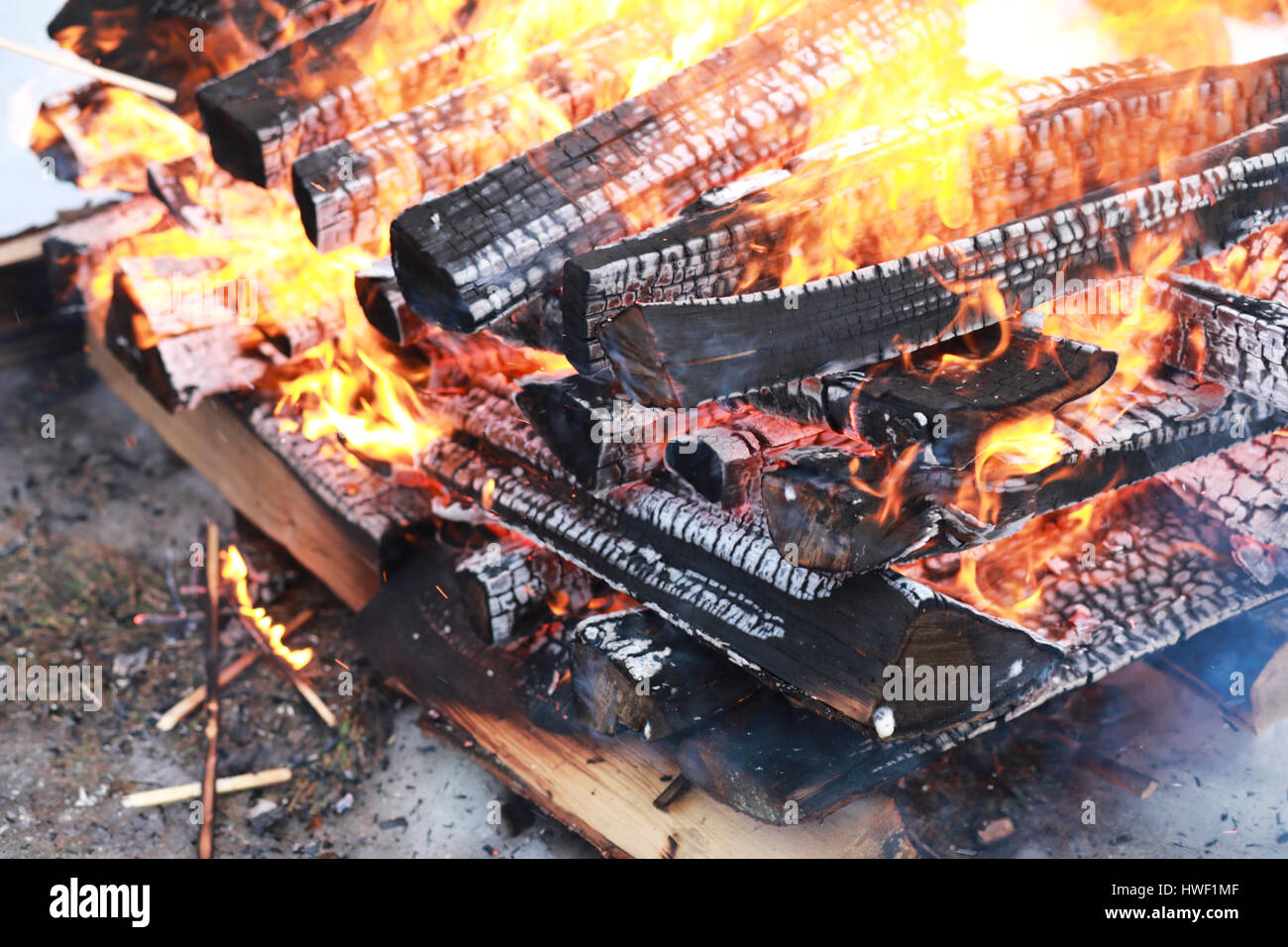 wooden logs burn with a bright flame in the fire Stock Photo - Alamy