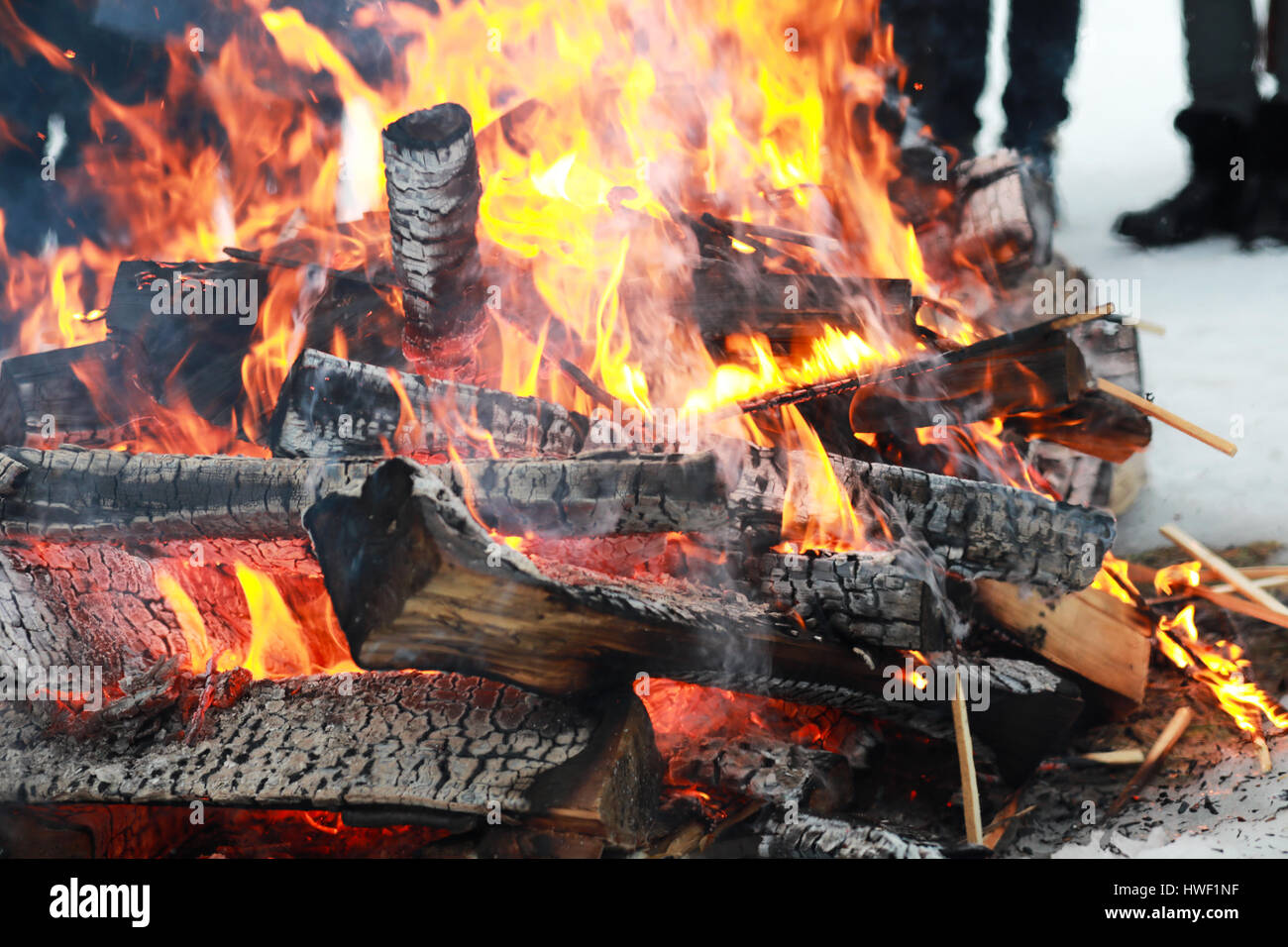 wooden logs burn with a bright flame in the fire Stock Photo - Alamy