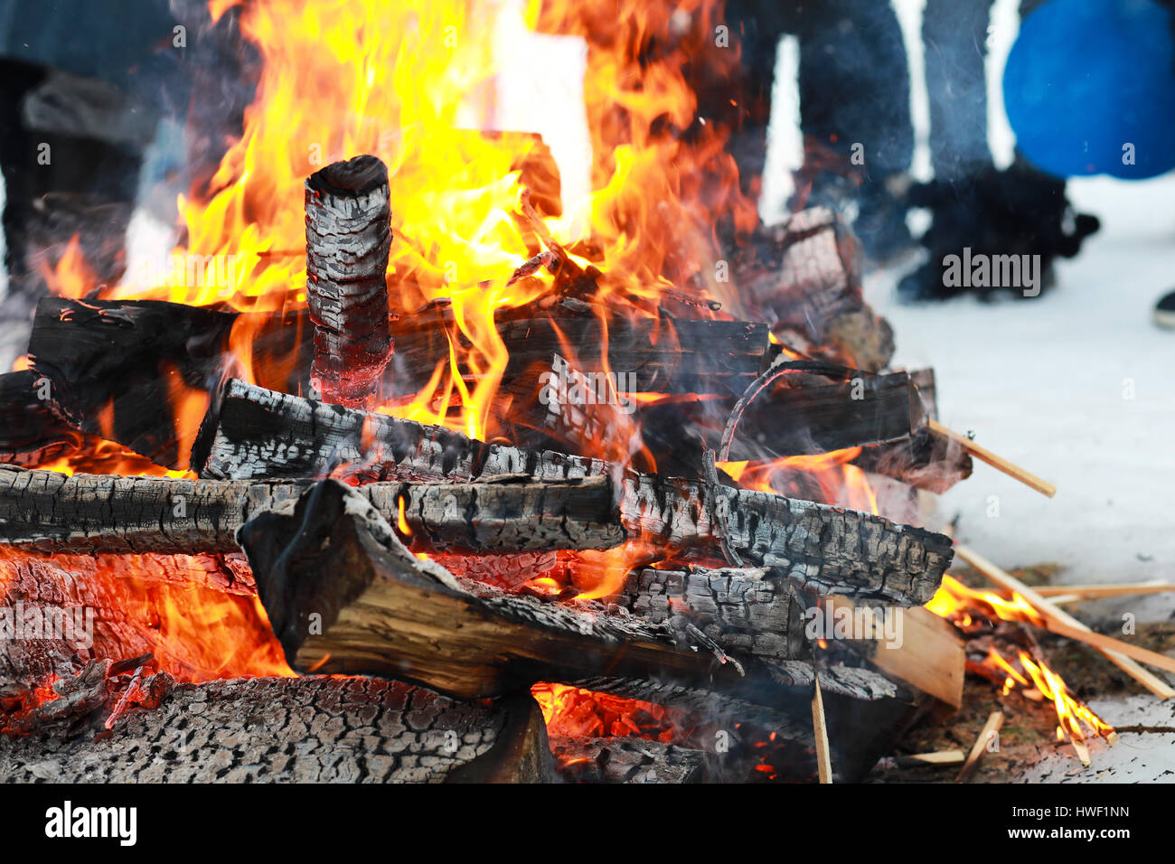wooden logs burn with a bright flame in the fire Stock Photo - Alamy