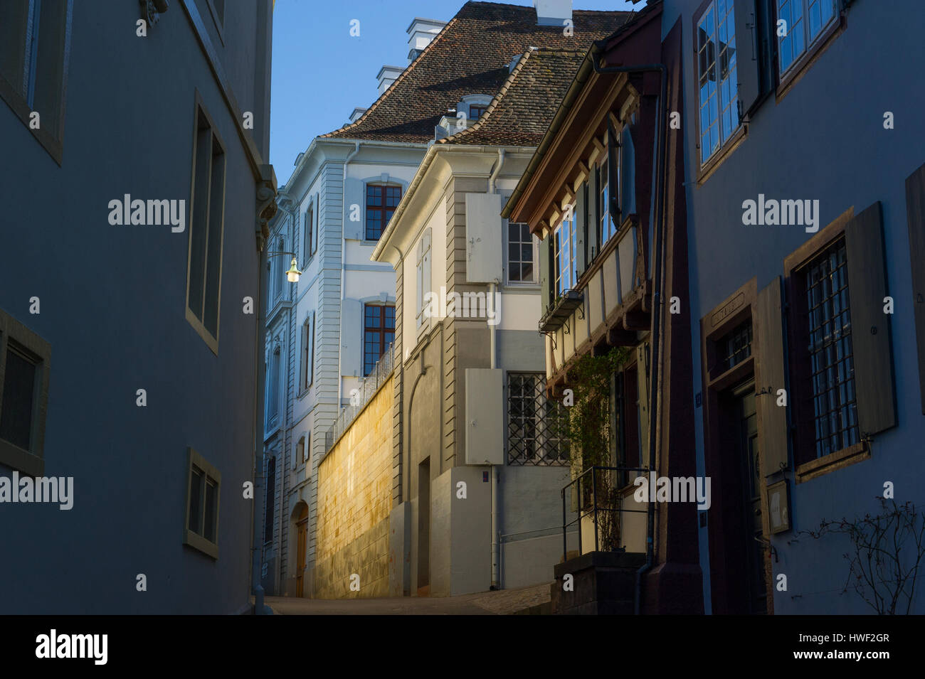 view of an alley with historic buildings in the old town of Basel ...