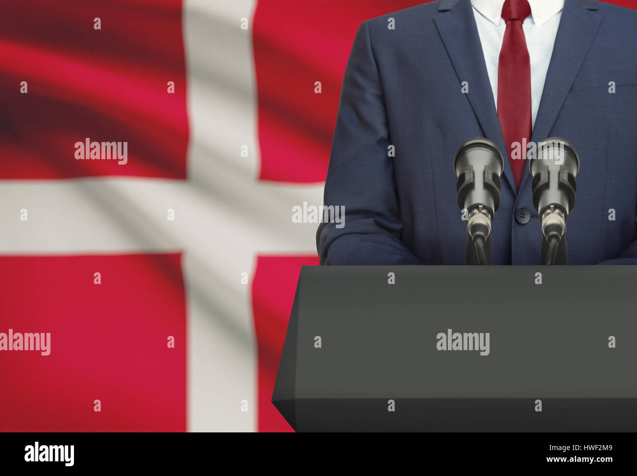 Businessman or politician making speech from behind the pulpit with ...
