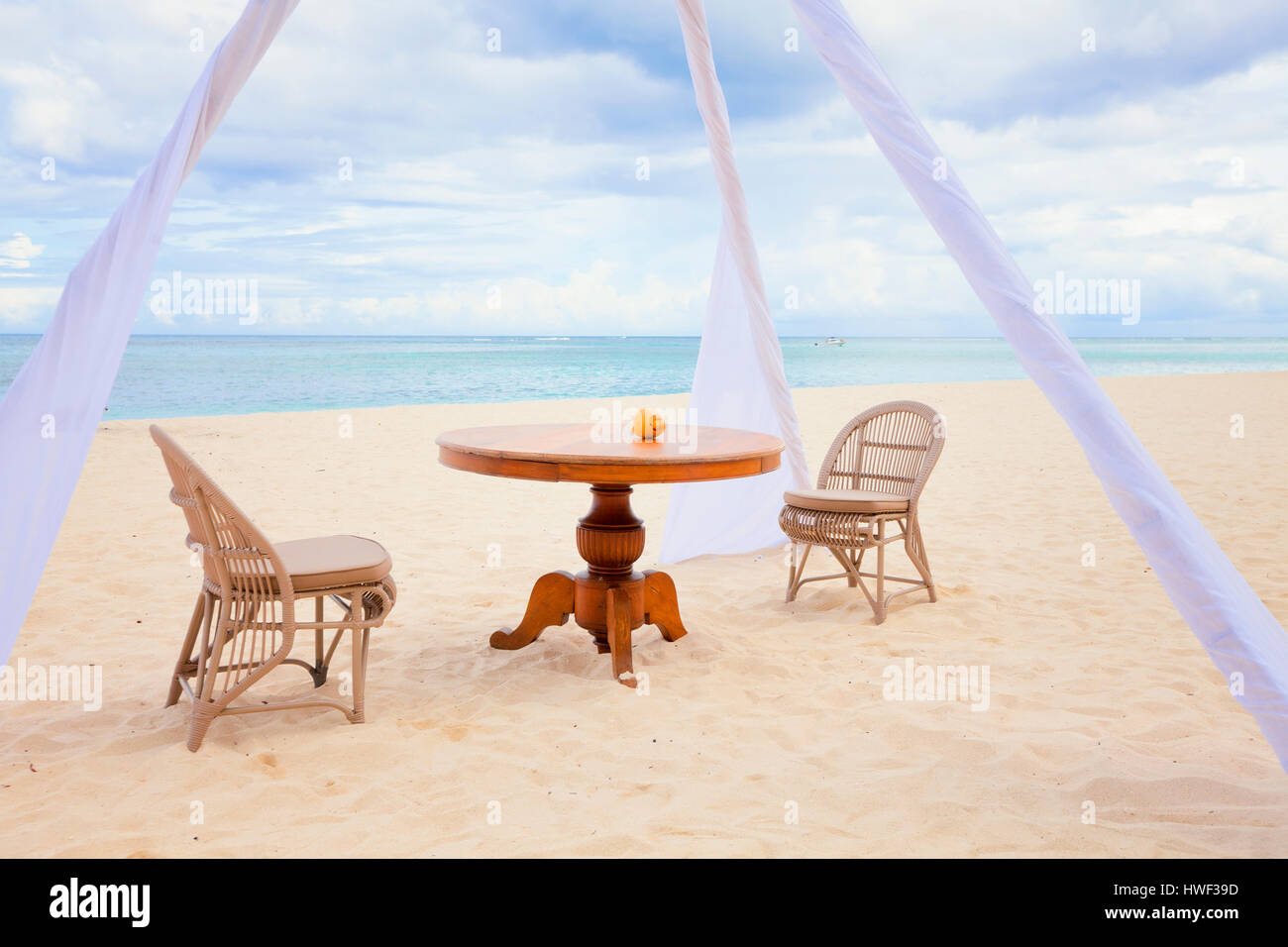 Private dining table and wicker chairs for romantic dinner for ...