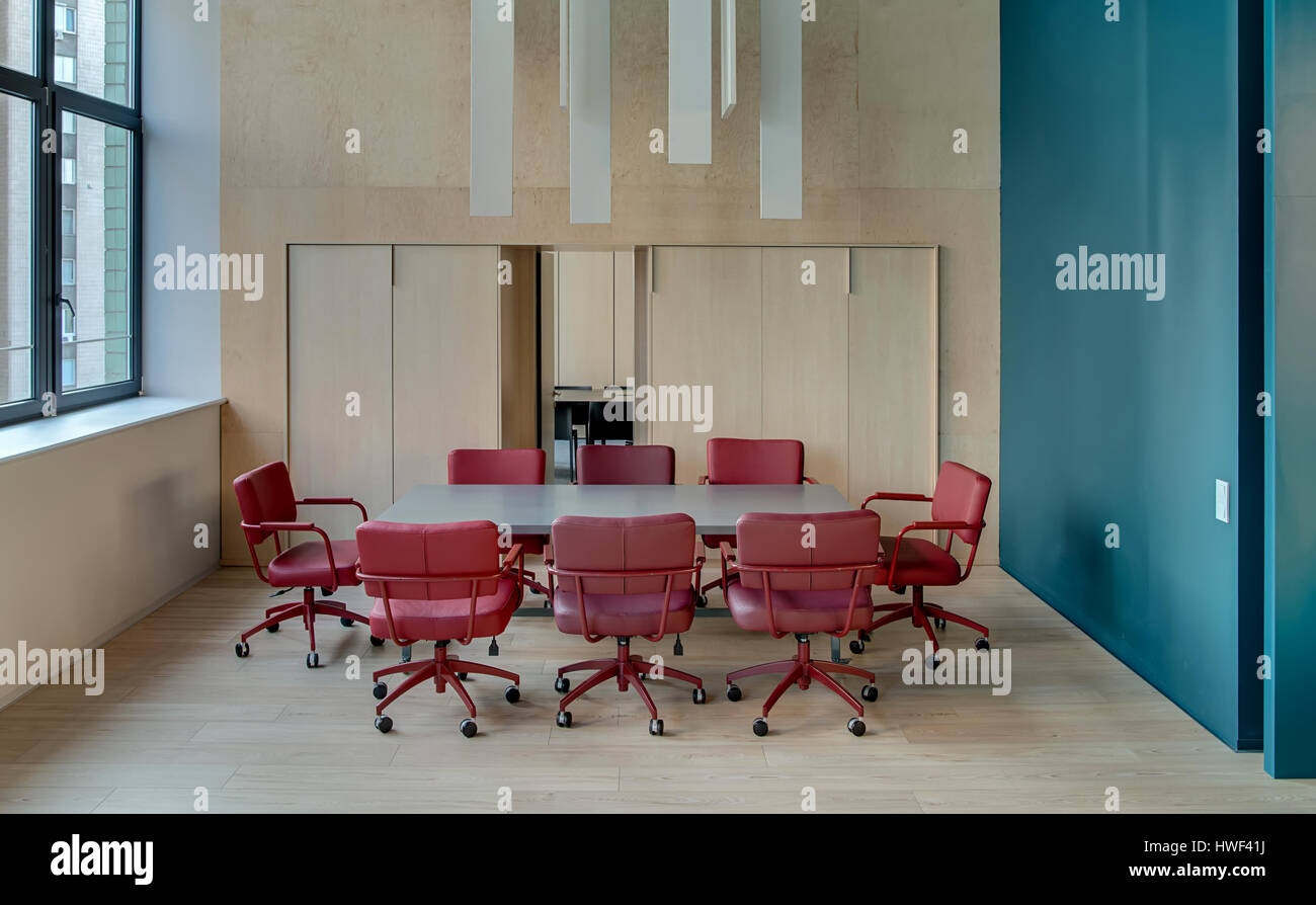 Meeting zone in the modern office with different walls and a parquet on ...