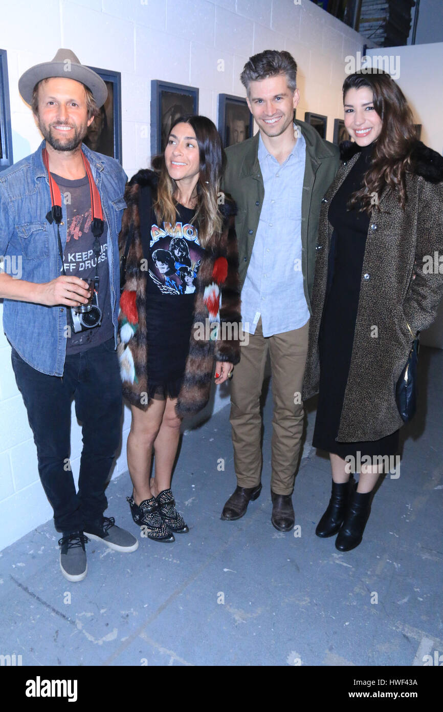 Guests attend Alex Sapienza's photography exhibition titled 'Everything ...