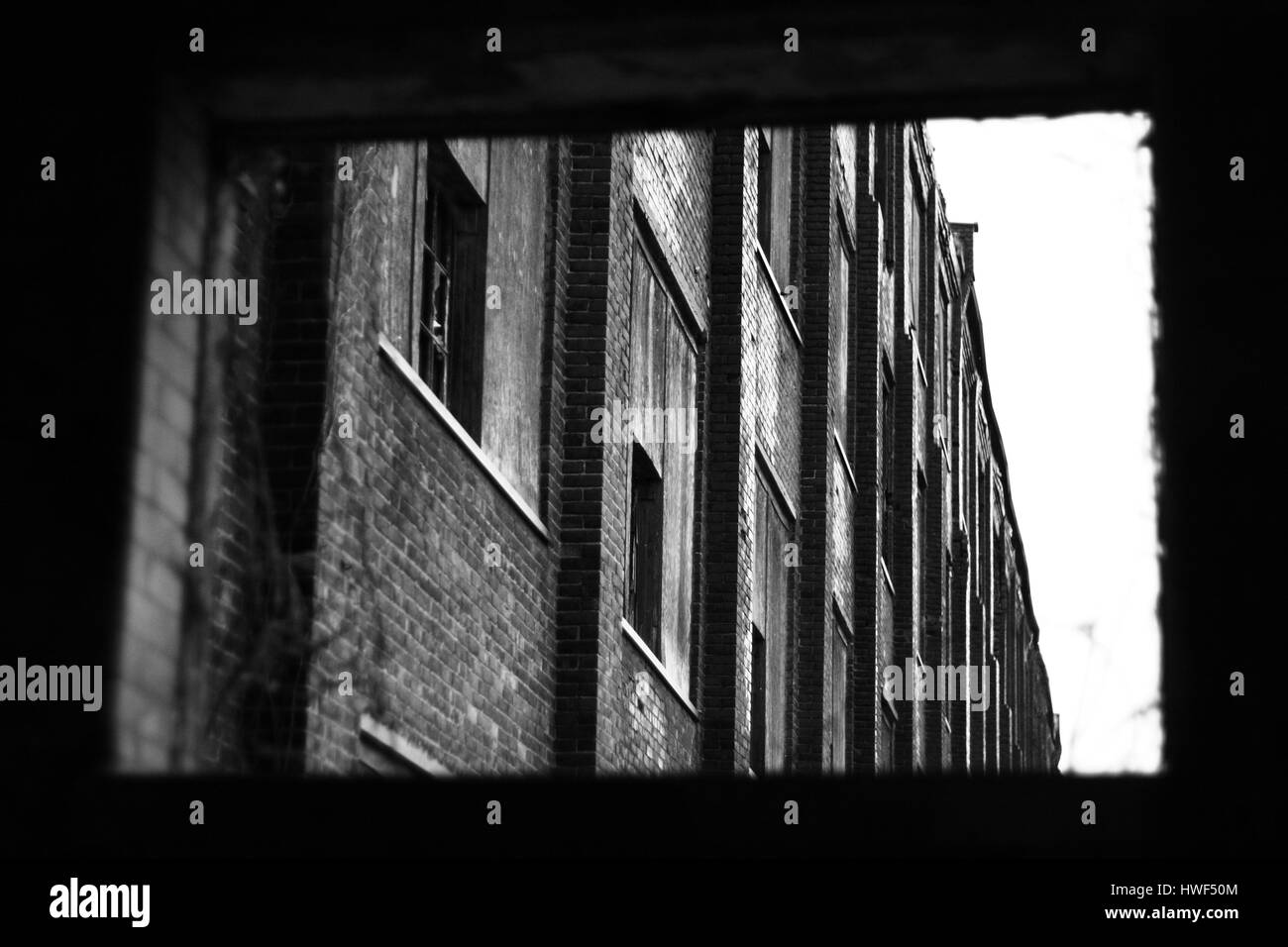 old building seen from a broken window frame Stock Photo - Alamy