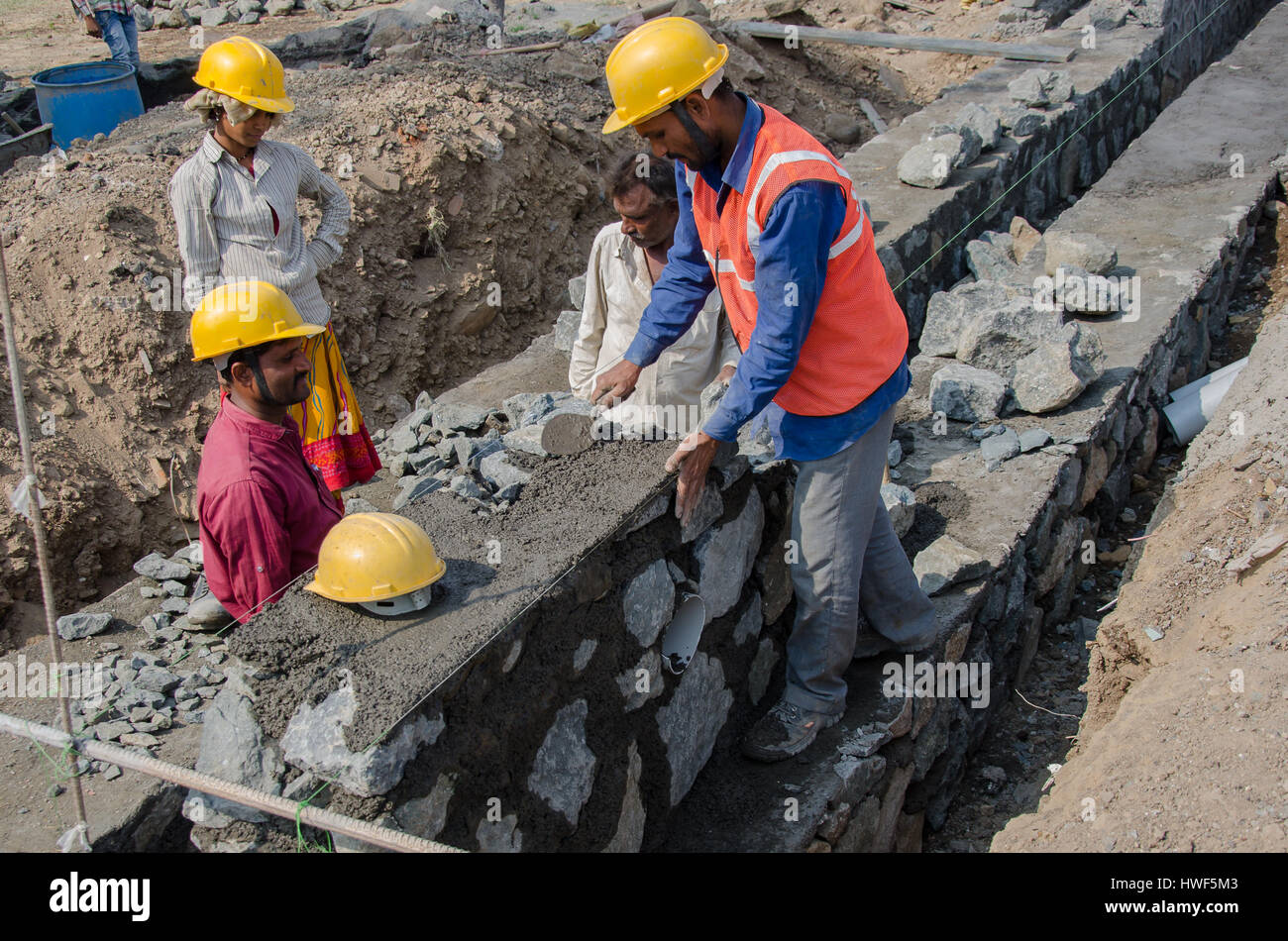 Navi Mumbai, India- 21st January, 2017. Construction labourer working ...