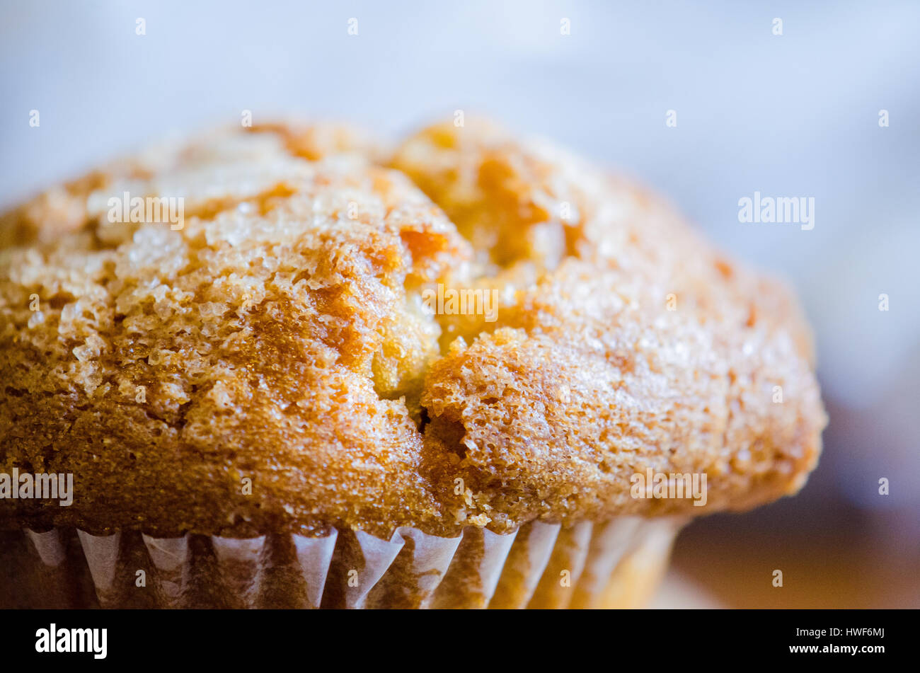 A close up of a golden brown muffin. These muffins are super yummy and ...