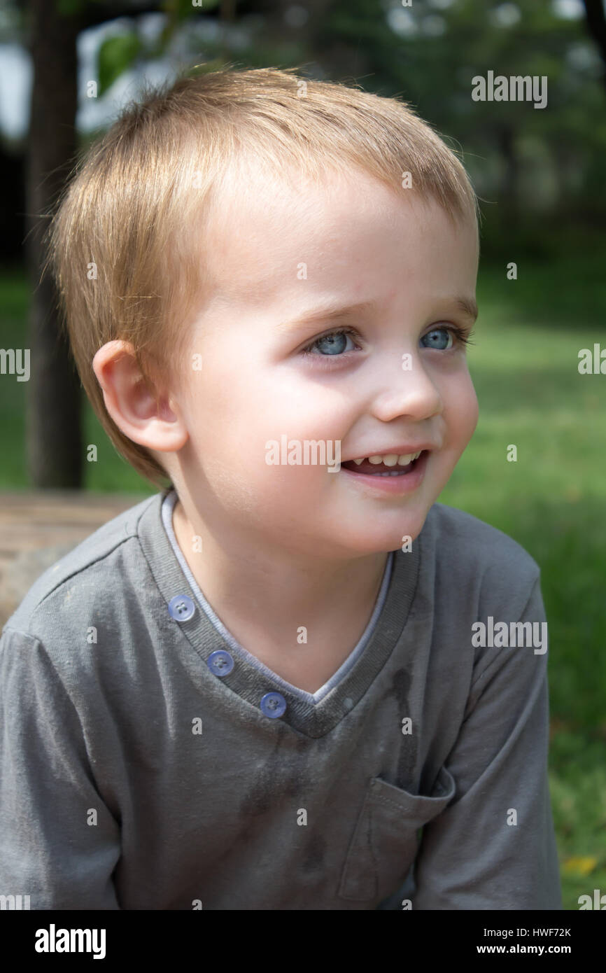 Portrait of a cute little smiling two year old boy out doors Stock ...