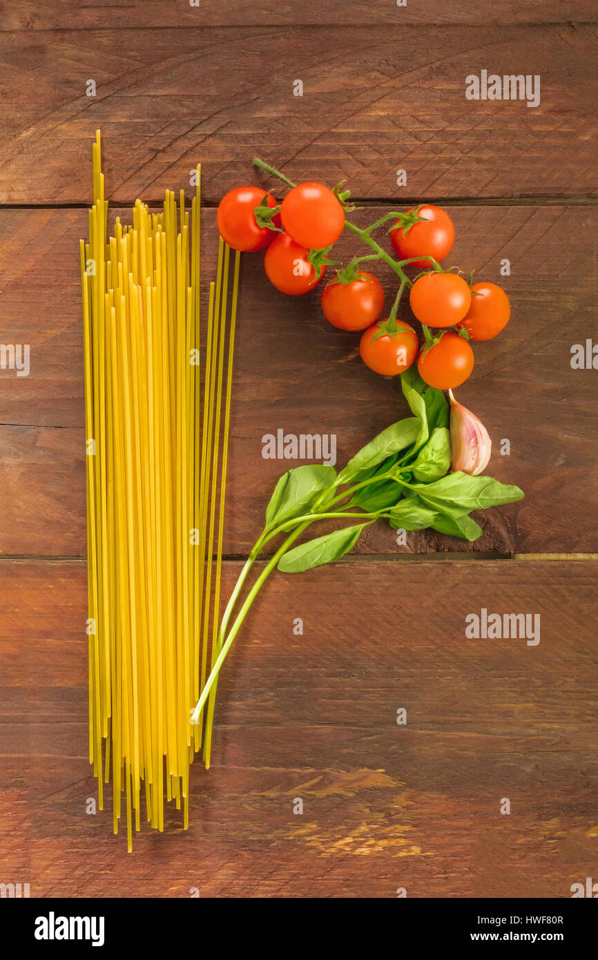 An overhead photo of a letter P for pasta, formed by spaghetti, cherry ...