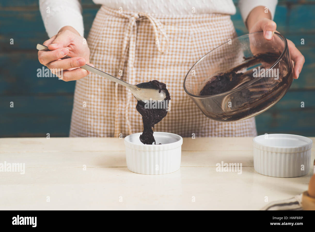 House wife wearing apron making. Steps of making cooking chocolate cake ...
