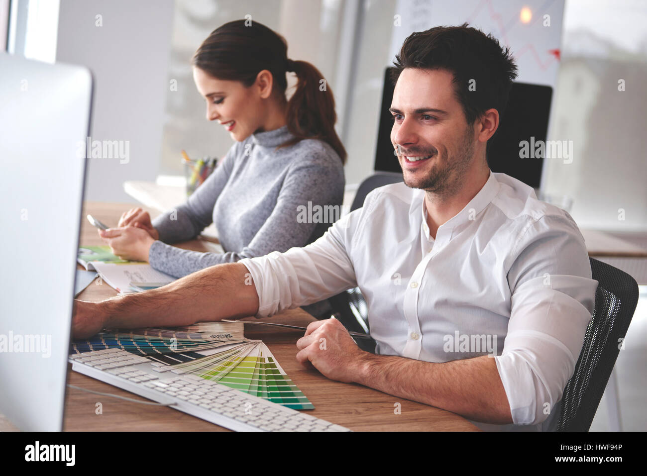 Business people working on wireless technology Stock Photo - Alamy