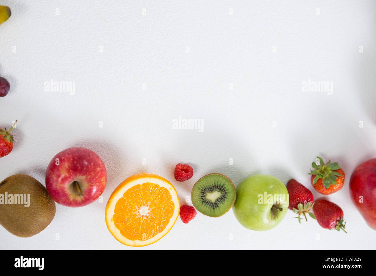 Close-up of various types of fruits arranged on white background Stock ...