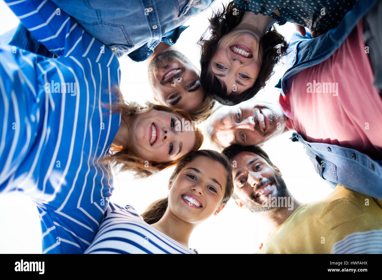 Smiling creative business team forming a hurdle outside Stock Photo - Alamy