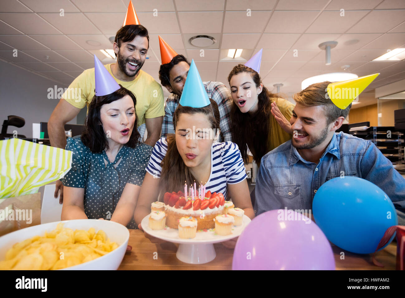 Creative business team celebrating colleagues birthday in office Stock ...