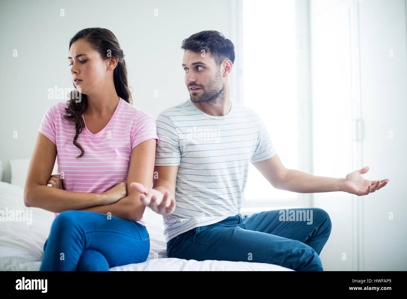 Couple arguing with each other in bedroom at home Stock Photo - Alamy
