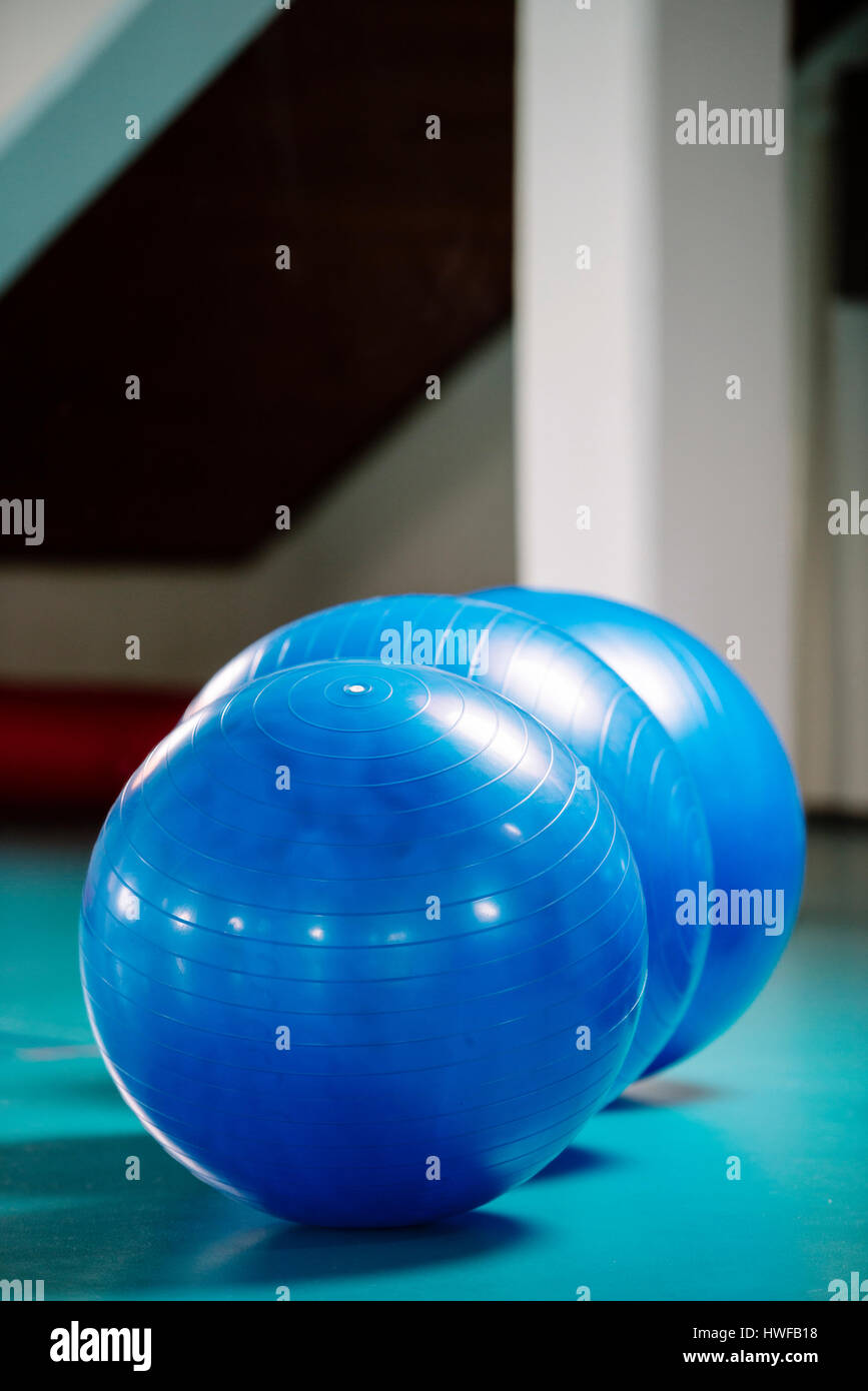Group of blue pilates balls in the gym Stock Photo - Alamy