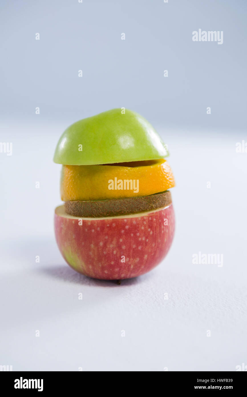 Stack Of Sliced Fruits Against White Background Stock Photo - Alamy