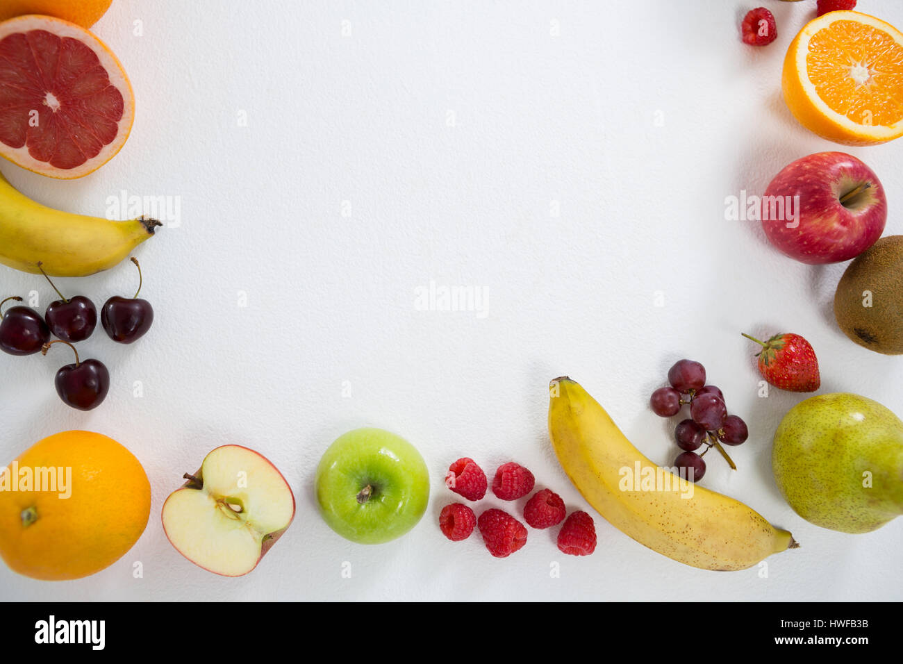 Close-up of various types of fruits arranged on white background Stock ...