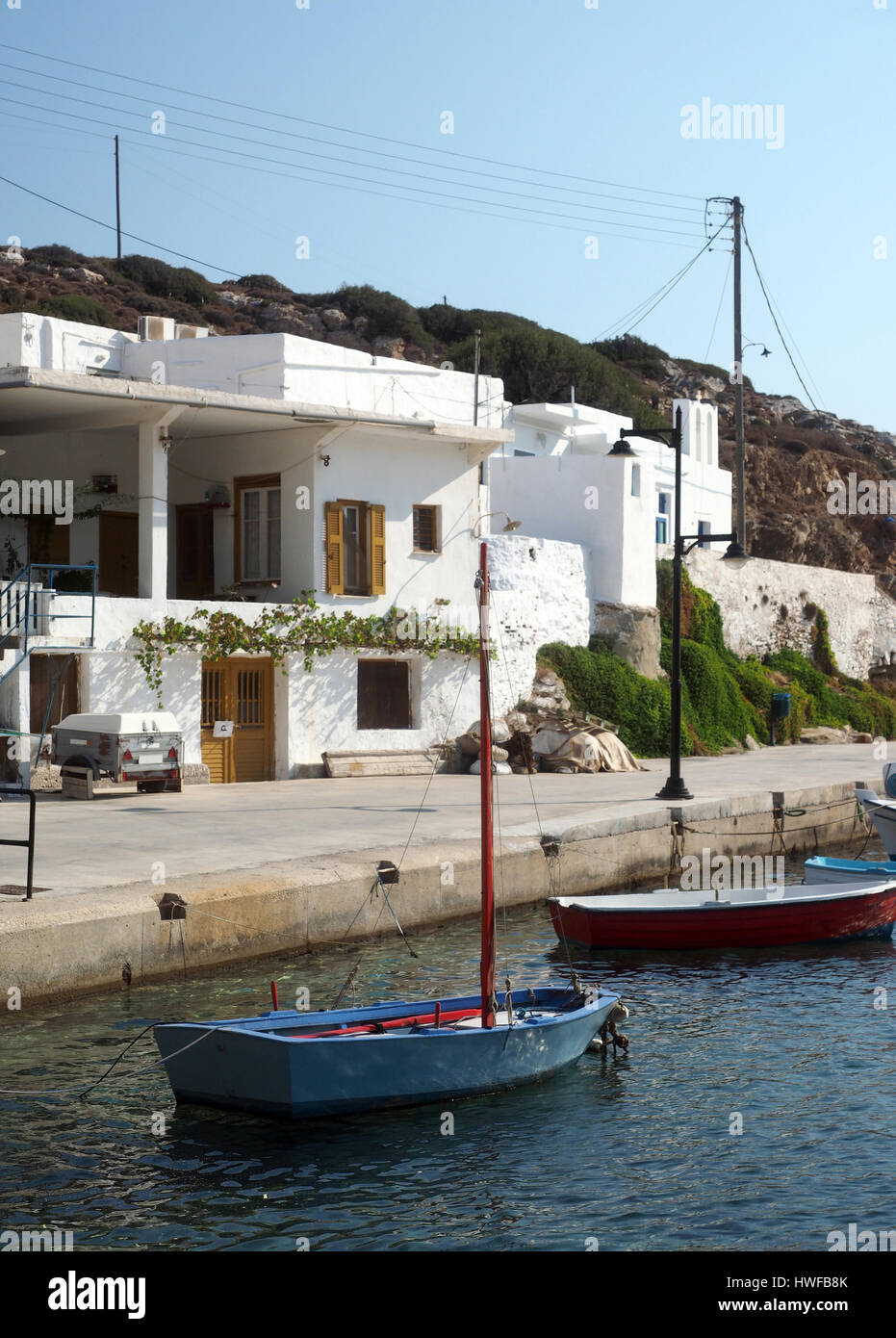 fishing boats and typical Greek architecture village Faros on Sifnos ...