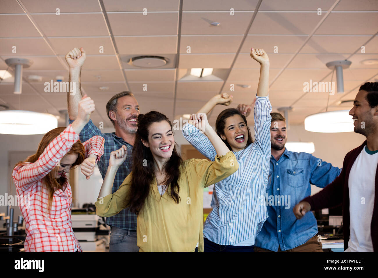 Creative team celebrating success on hi-res stock photography and ...