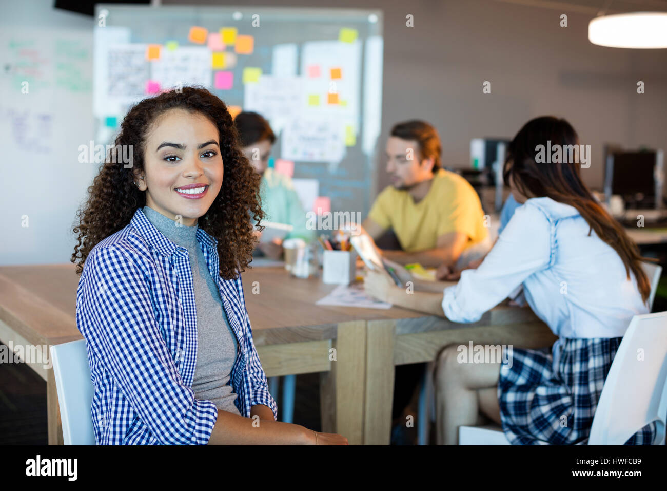 Pretty office woman at conference table hi-res stock photography and ...