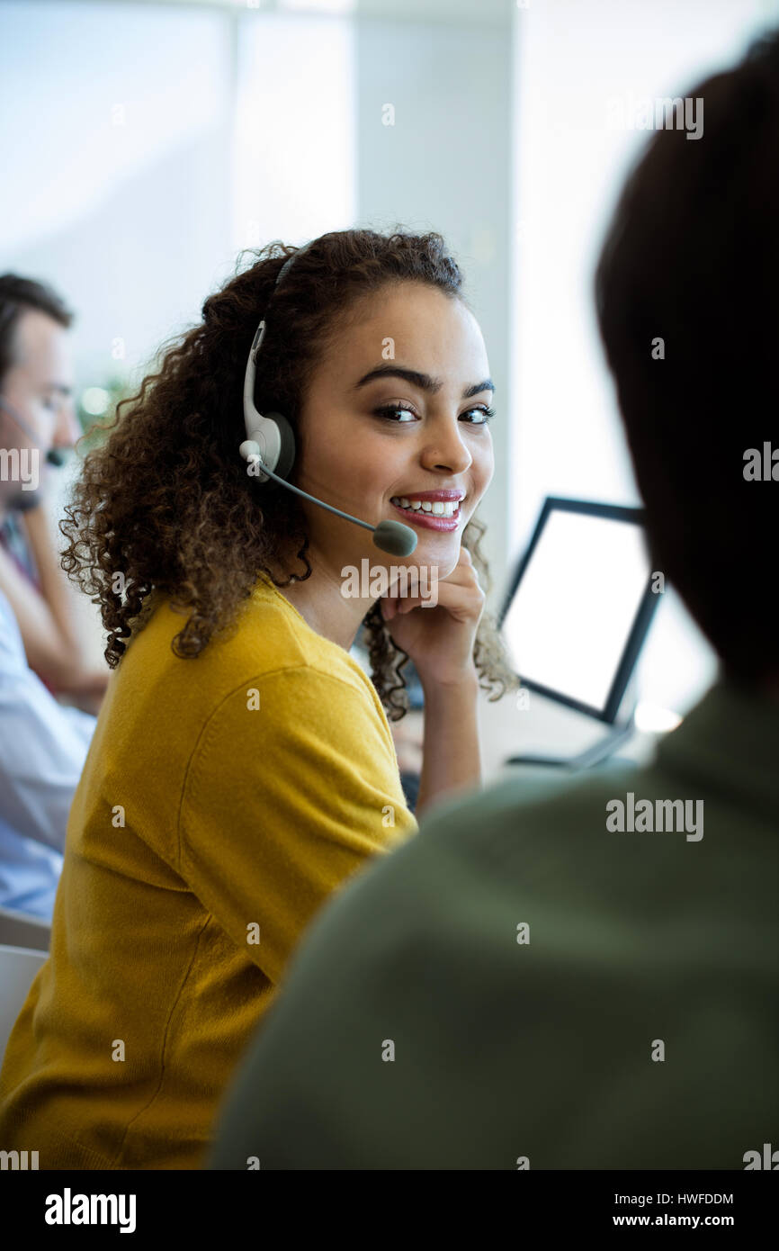 Portrait of customer service executive working at office Stock Photo ...
