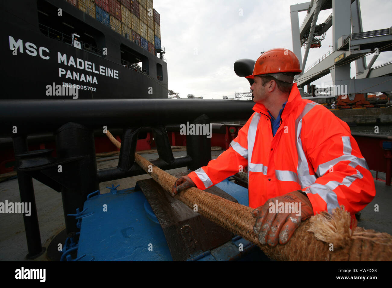 tugboat at work in rotterdam harbor Stock Photo - Alamy